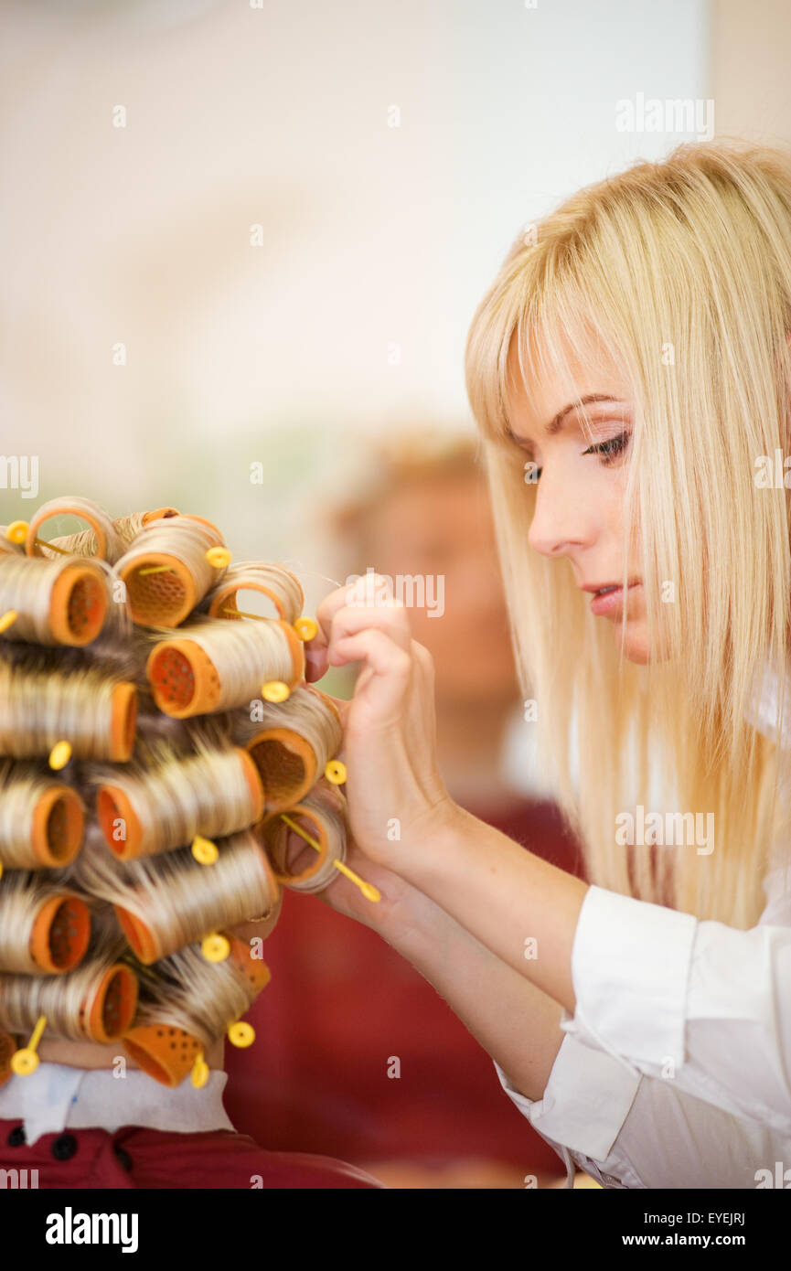 Female hairdresser working in beauty salon Stock Photo - Alamy