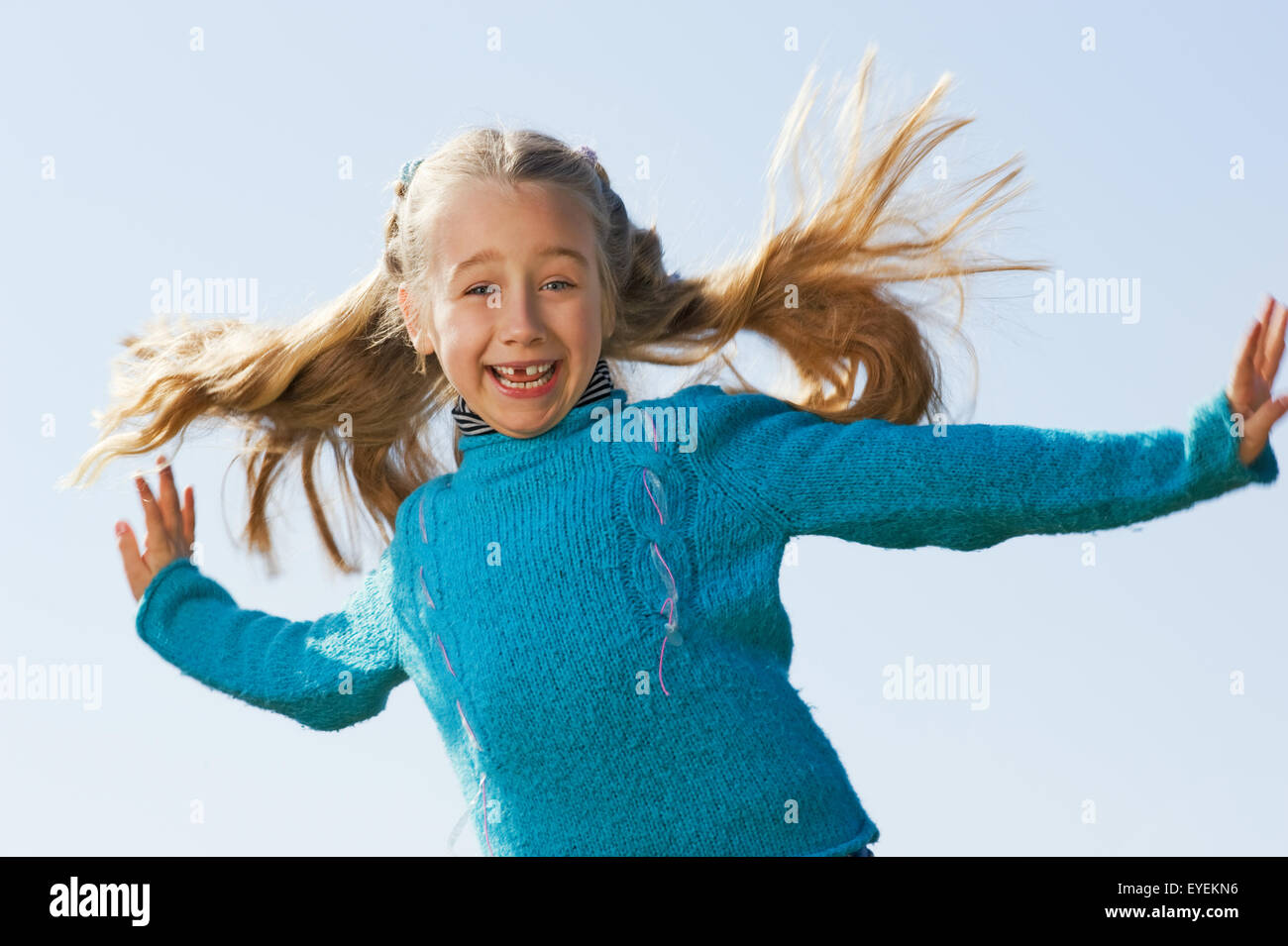 Little girl jumping outdoors Stock Photo - Alamy
