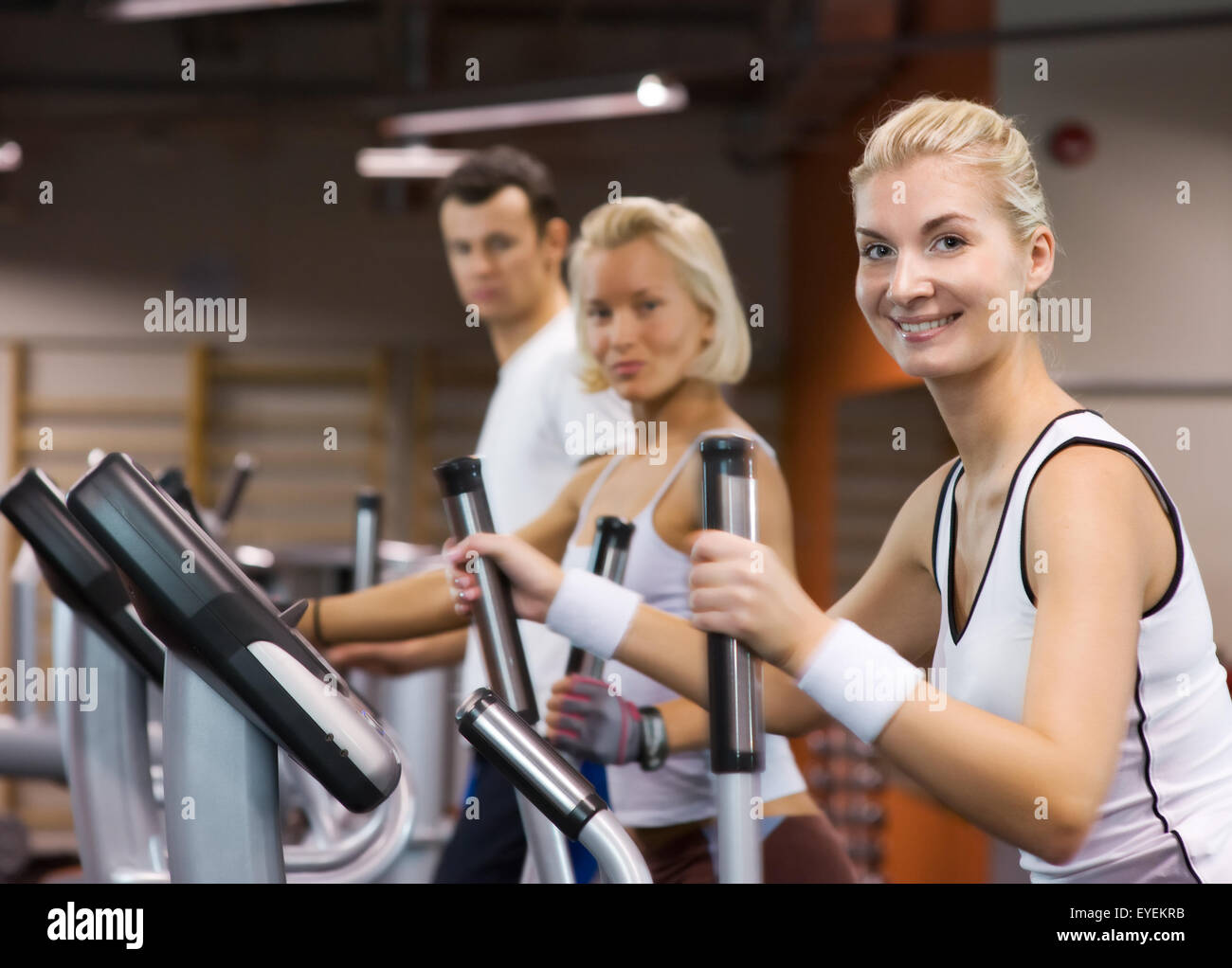 Group of people jogging in a gym Stock Photo - Alamy