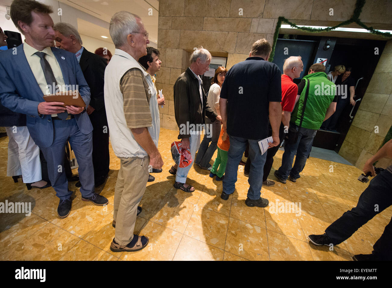 Stuttgart, Germany. 28th July, 2015. People line up in front of the ...