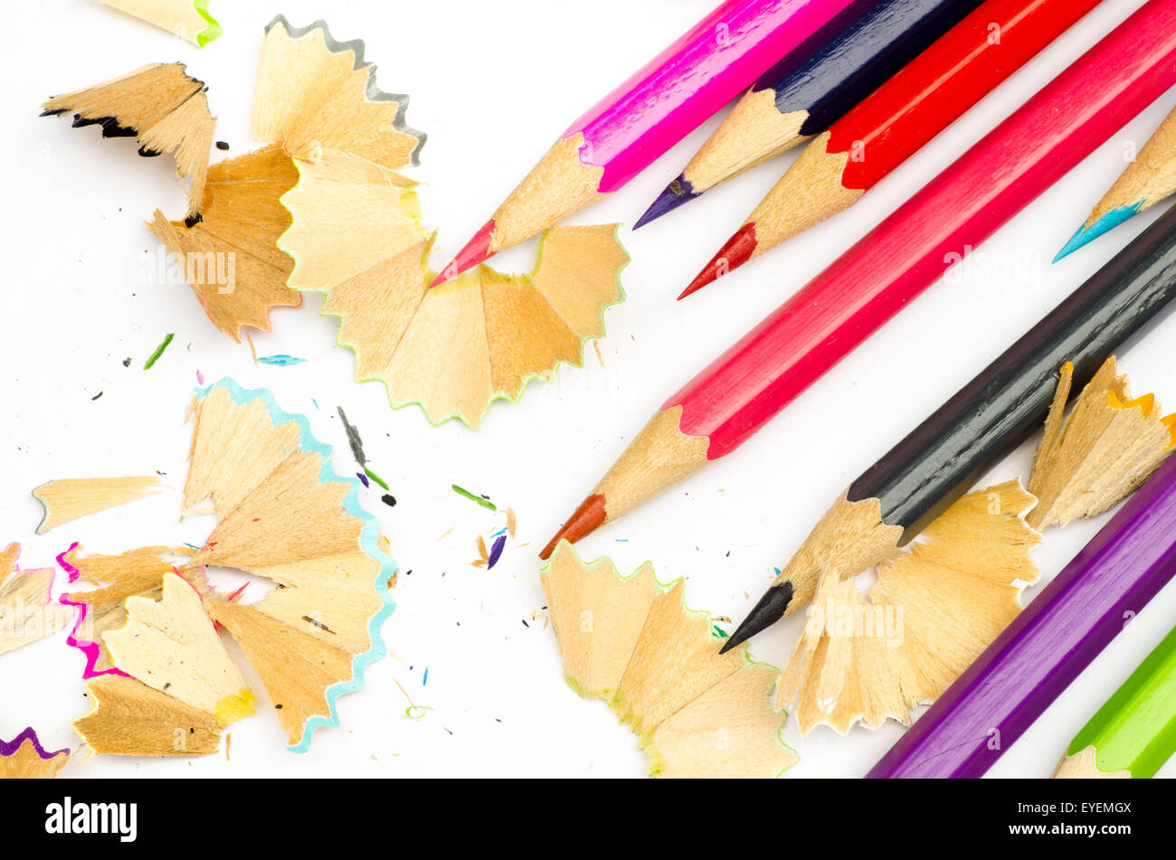 multicolored crayons on white paper background Stock Photo - Alamy