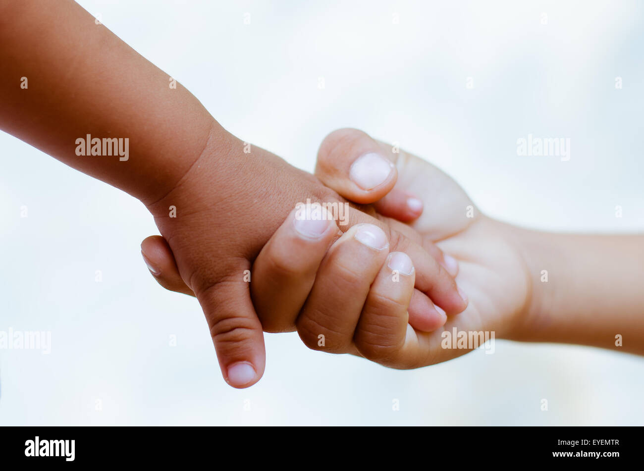 Two Brothers Take The Hand Stock Photo - Alamy