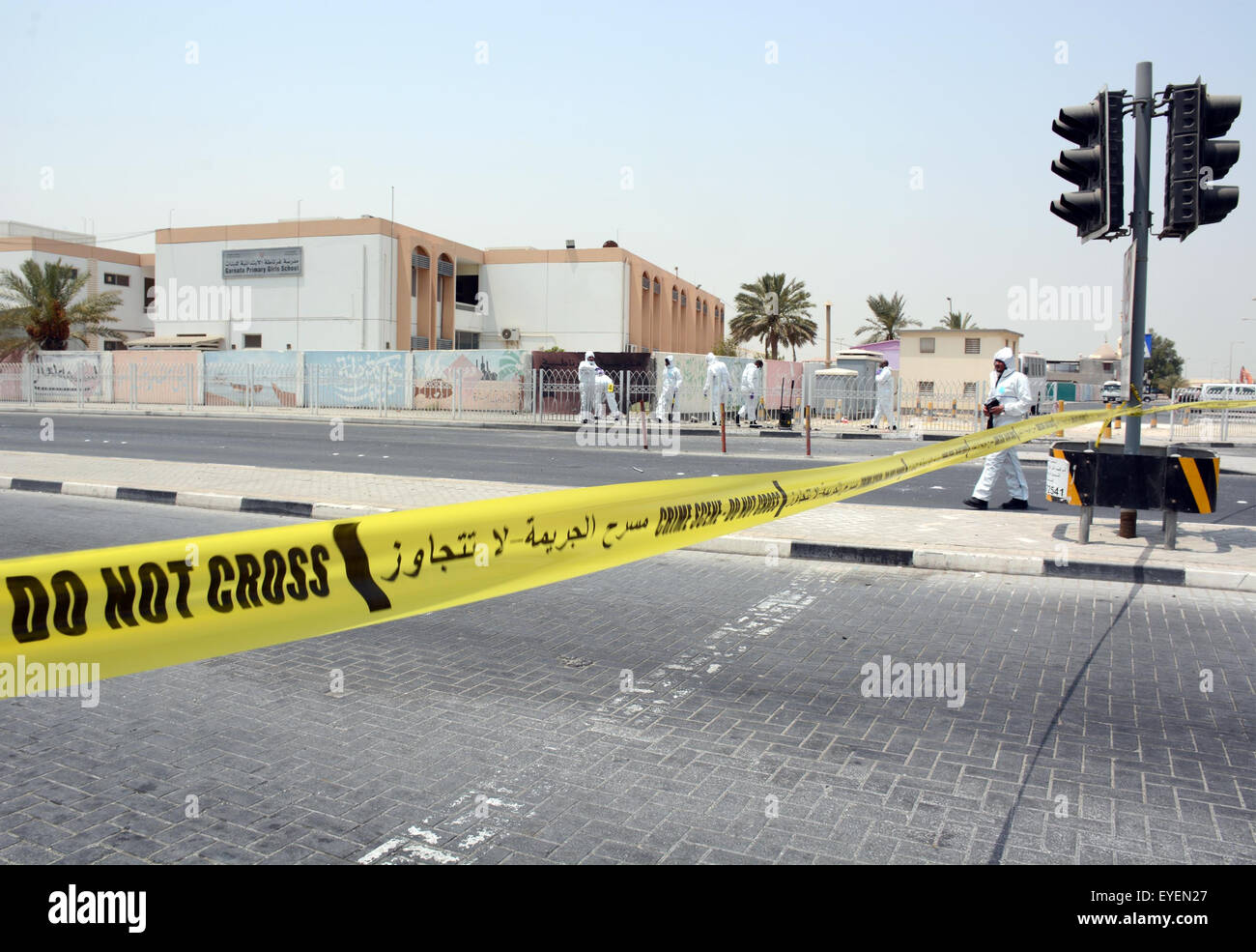 Manama, Bahrain. 28th July, 2015. Policemen inspect the site of a ...