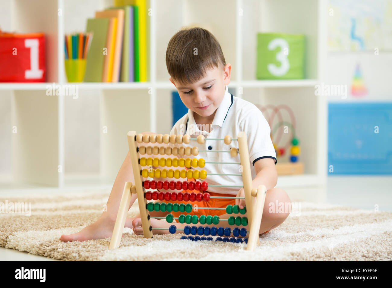child playing with abacus Stock Photo - Alamy