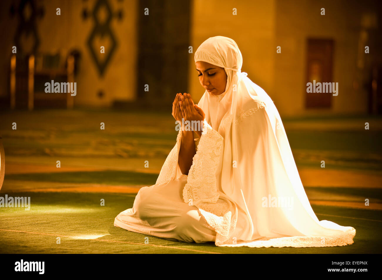 Woman praying in a mosque; Bandar Seri Begawan, Brunei Stock Photo - Alamy