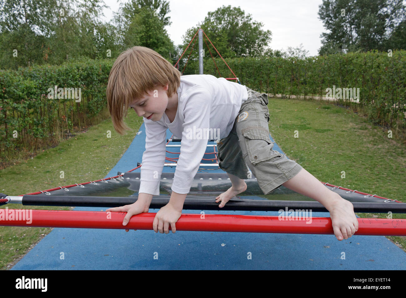 young boy on a playground Stock Photo - Alamy
