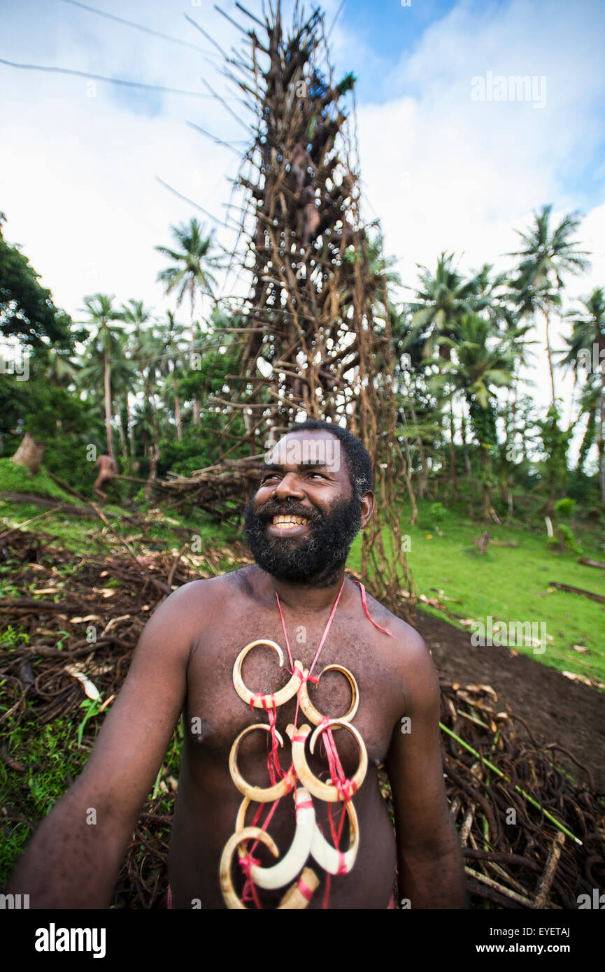 Pentecost chief stands before a land diving tower; Pentecost Island ...