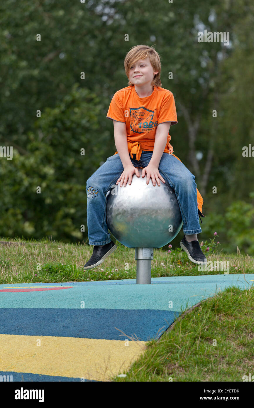 young boy on a playground Stock Photo - Alamy