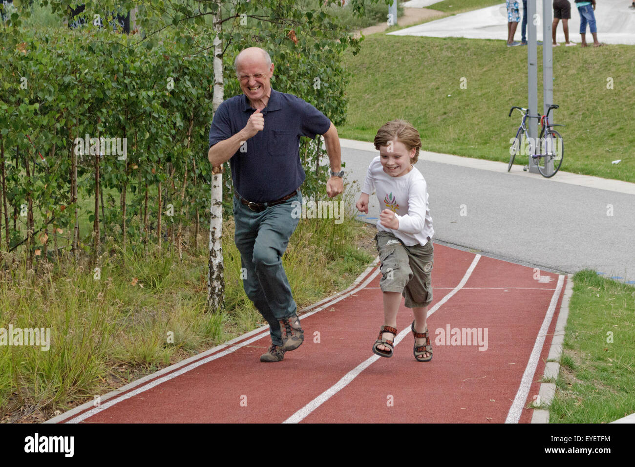 grandfather and grandson having a race Stock Photo - Alamy