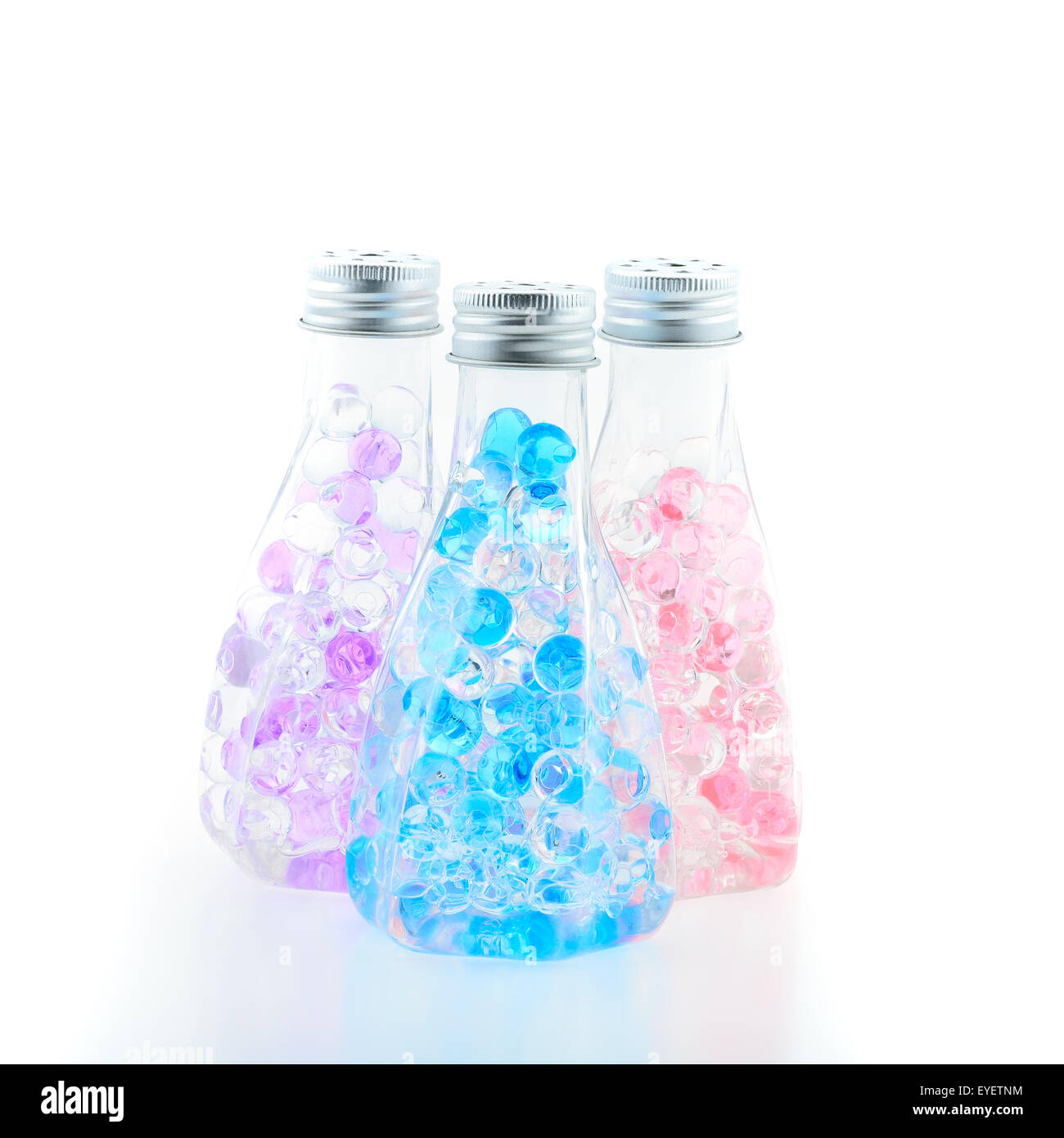 Three colorful bottles with beautiful gelatin inside, isolated on white ...