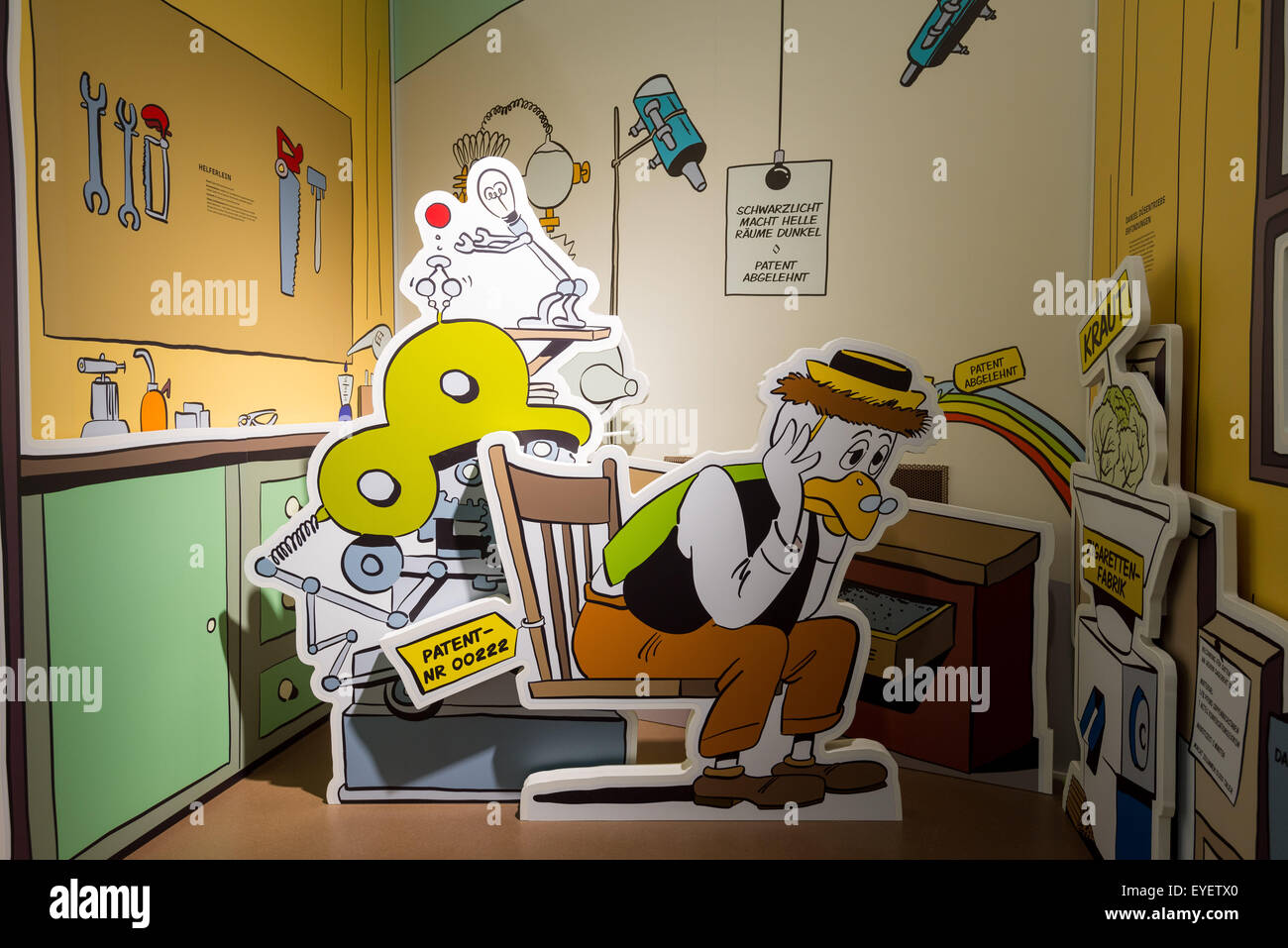 An image of the comic character Gyro Gearloose sitting in his workshop ...