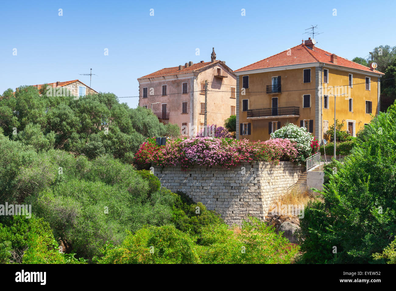 Figari street view with colorful old living houses, South Corsica ...