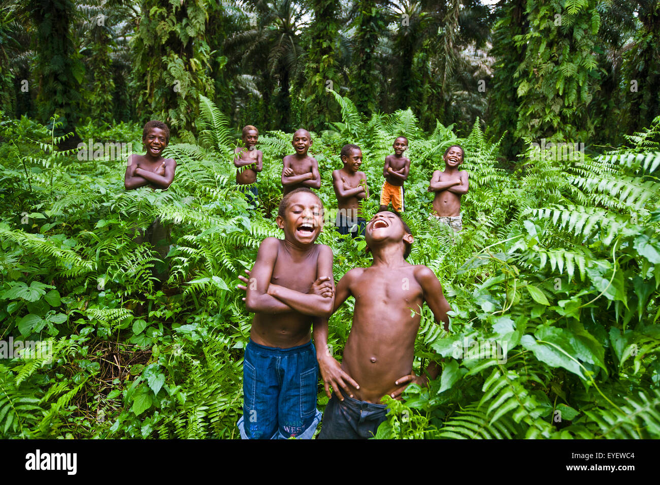 Young boys laughing; West New Britain, Papua New Guinea Stock Photo - Alamy