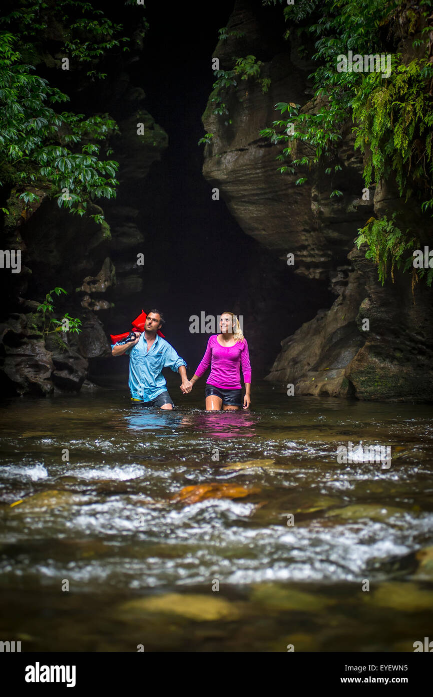 Couple doing the Millennium Cave hike; Santo Island, Vanuatu Stock ...