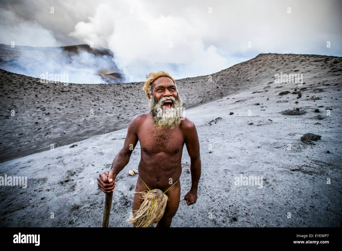 A local landowner standing at the rim of Yasur Volcano; Tanna Island ...