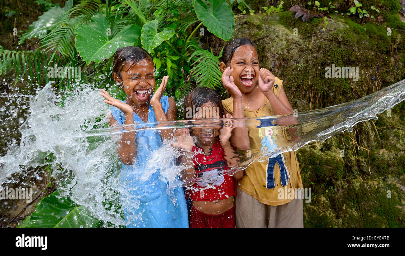 Timorese children playing with water; Timor-Leste Stock Photo - Alamy