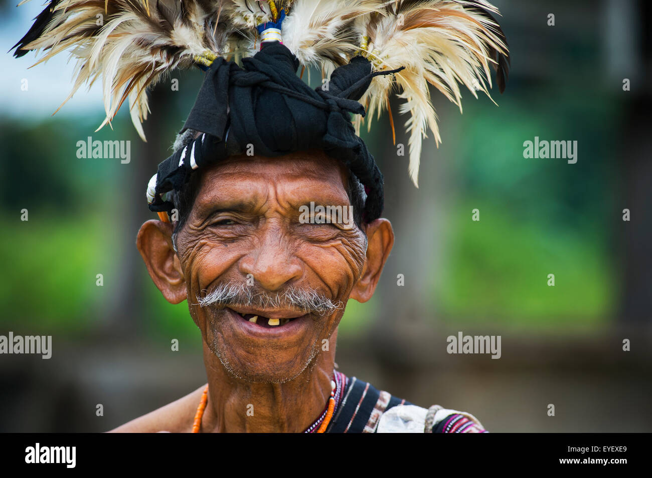 Elderly man in traditional attire; Lospalmos district, Timor-Leste ...