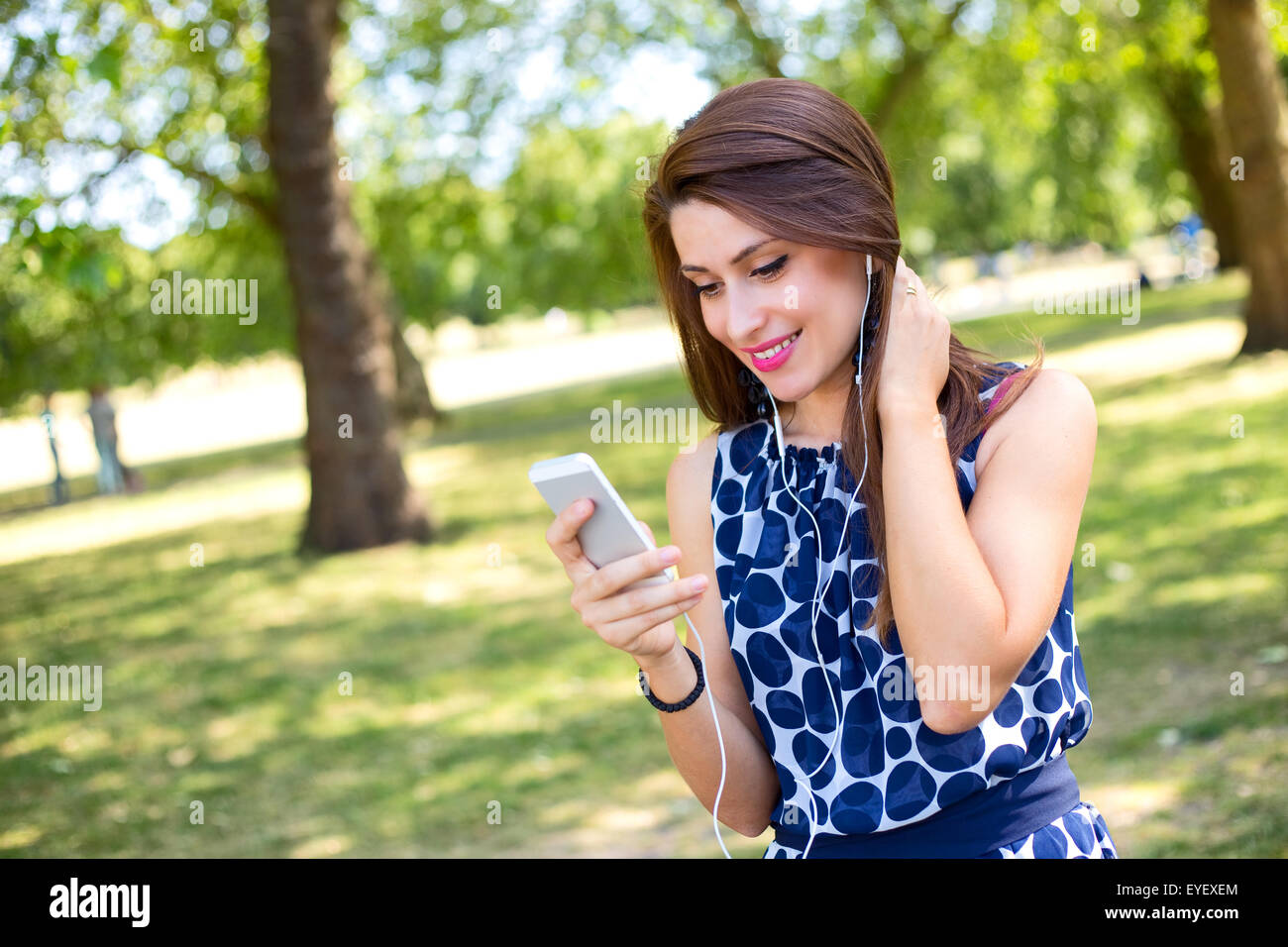 young woman using her phone Stock Photo - Alamy