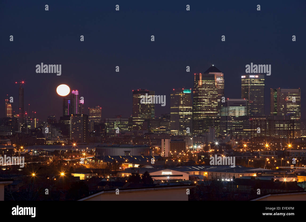 Setting full moon over Canary Wharf; London, England Stock Photo - Alamy
