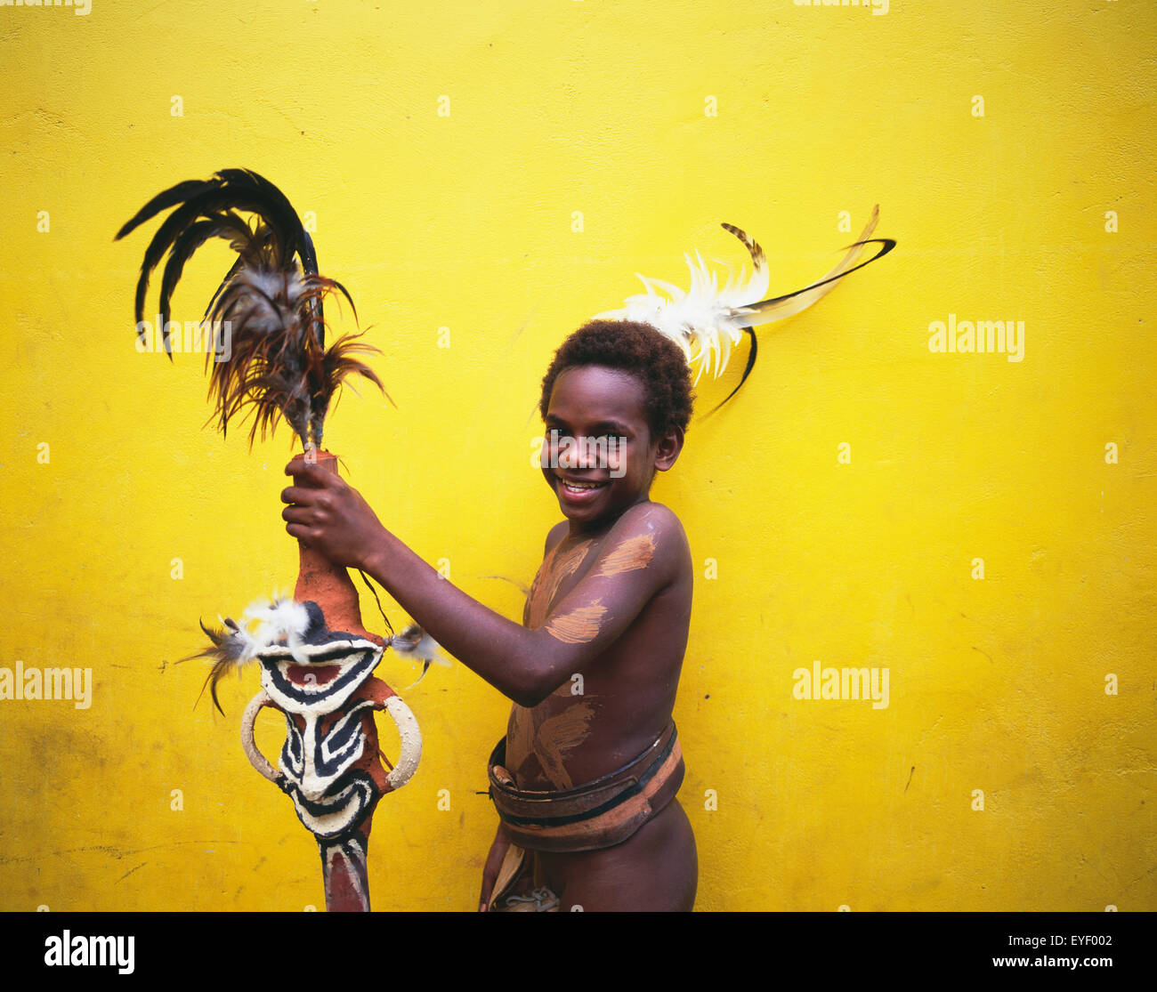 Boy holding traditional malekula artifact; Malekula Island, Vanuatu ...