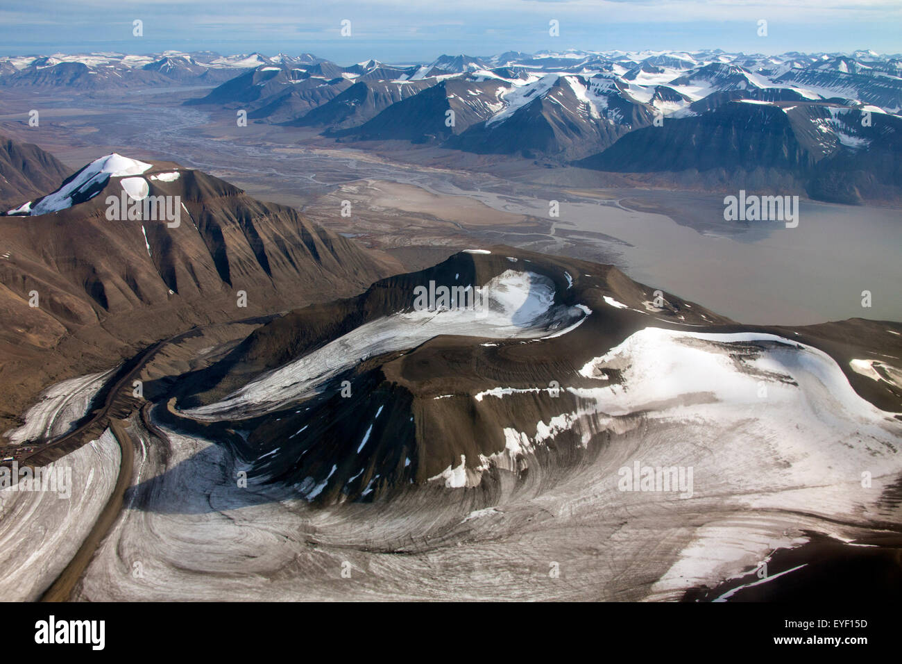 Aerial view of mountainous landscape with U-shaped glacial valley and ...