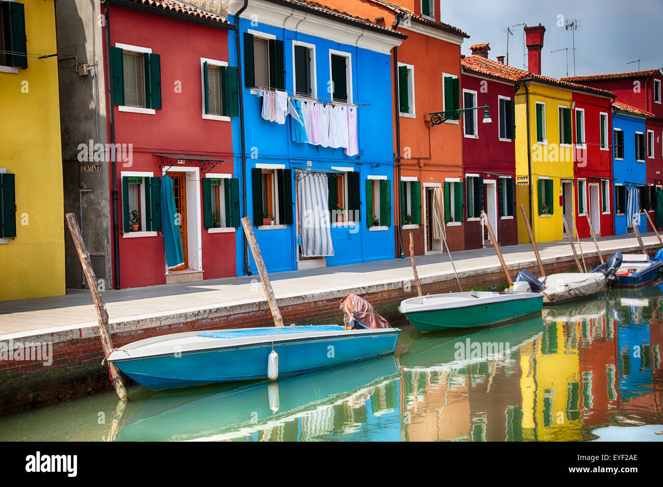 Row brightly coloured houses sit hi-res stock photography and images ...