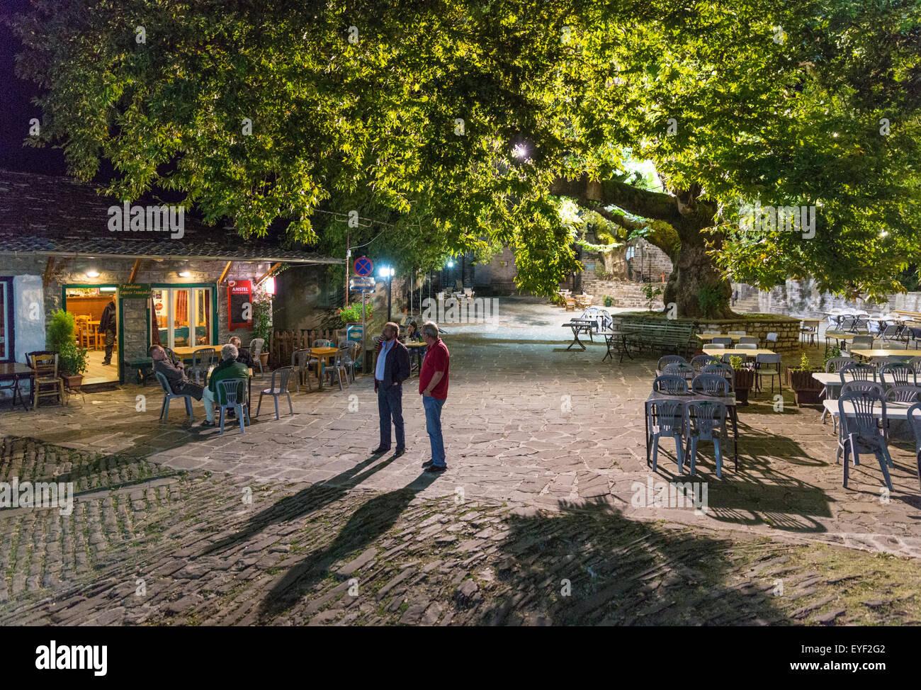 Night view of main square of Tsepelovo Greece, one of the stone ...