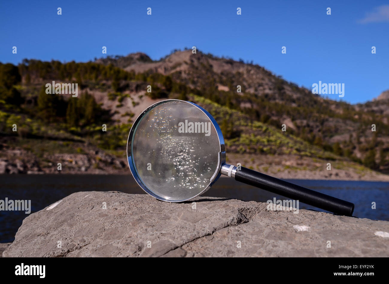Magnify Glass Loupe on the Volcanic Rock Stock Photo - Alamy