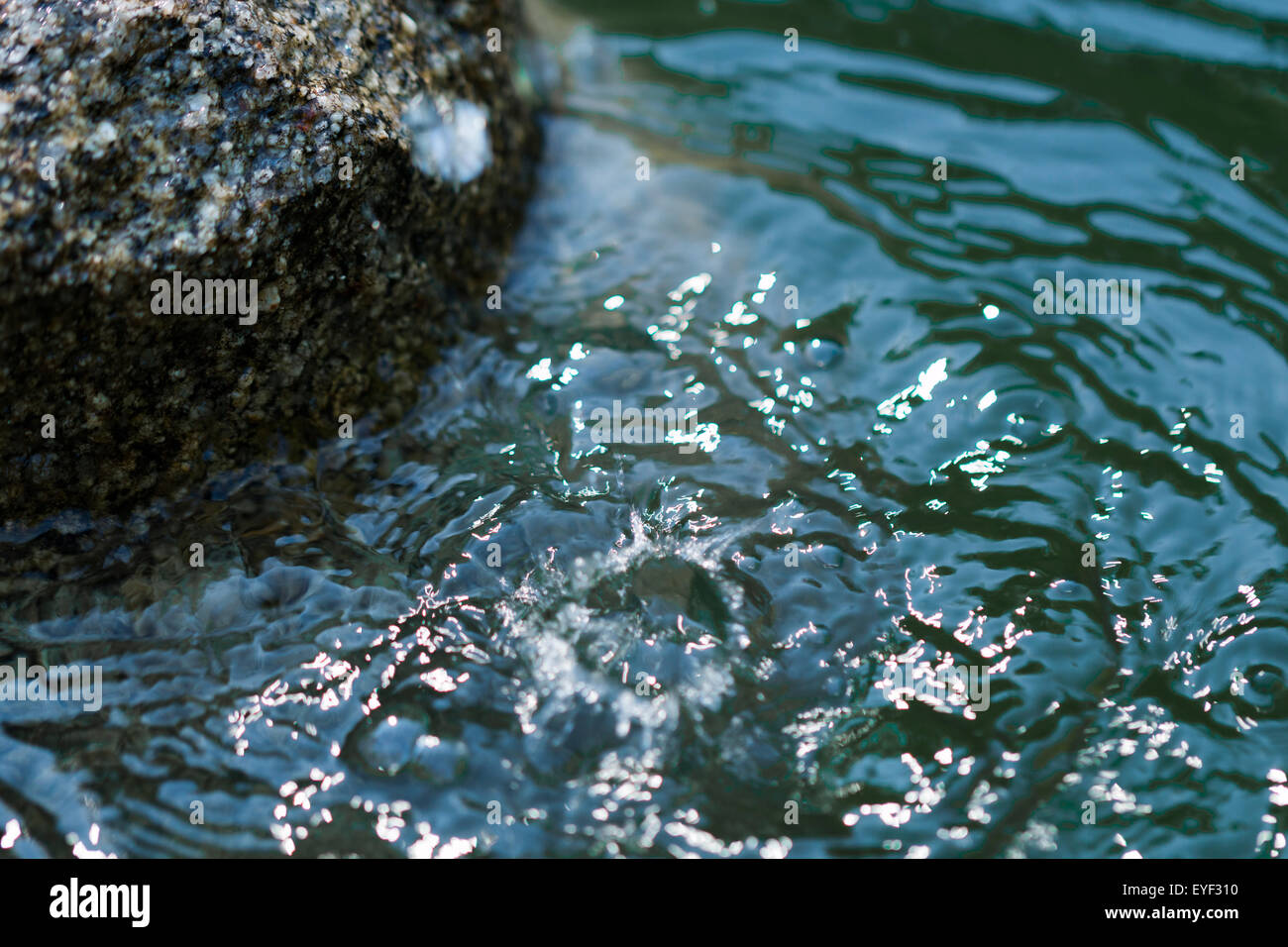 Water drop falling to the fountain Stock Photo - Alamy