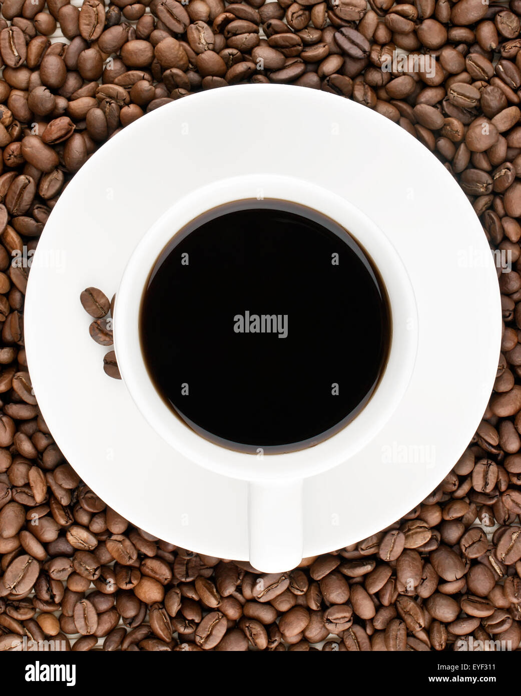 Coffee cup view from top on beans background Stock Photo - Alamy