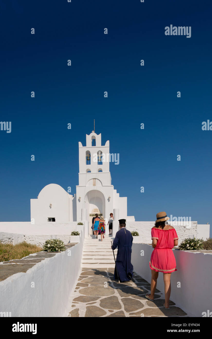 A priest arriving for a wedding at the Chrysopiyi Monastery; Sifnos ...