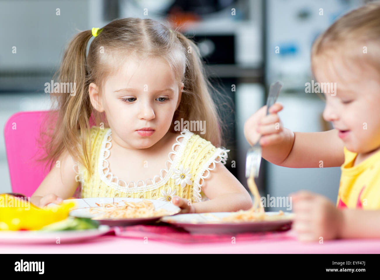 kids eating in kindergarten or at home Stock Photo - Alamy
