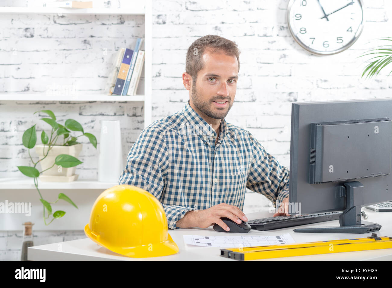 young engineer working on his computer in his office Stock Photo - Alamy