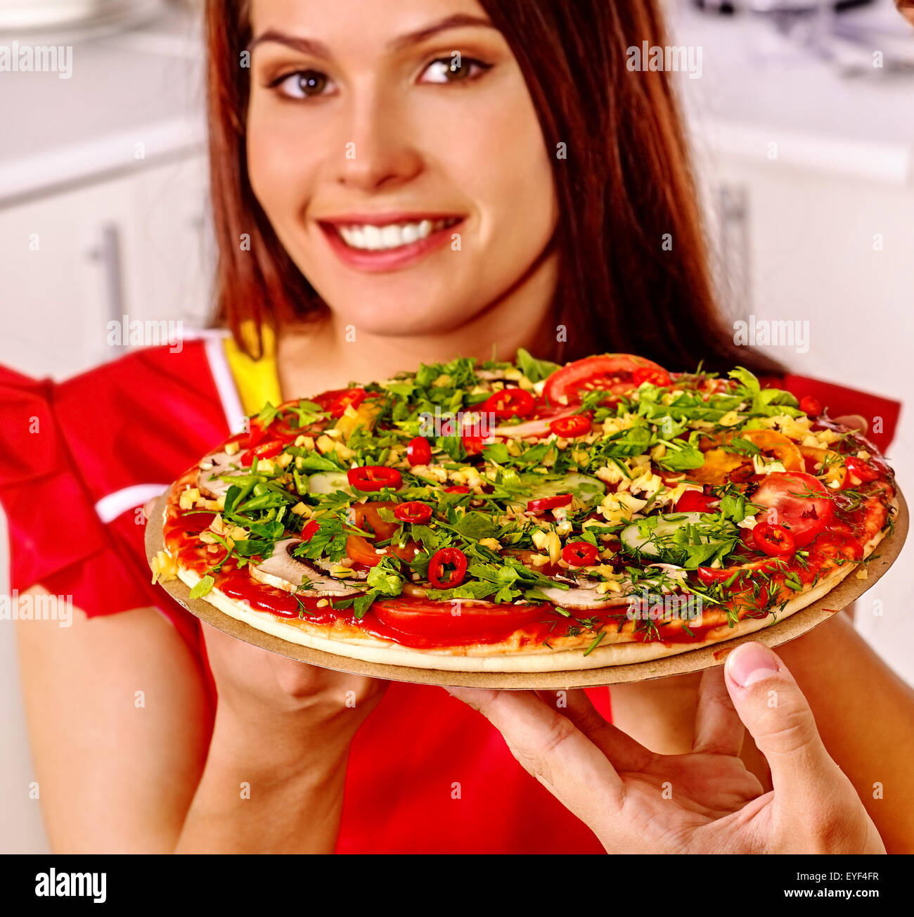 Happy woman cooking pizza Stock Photo - Alamy