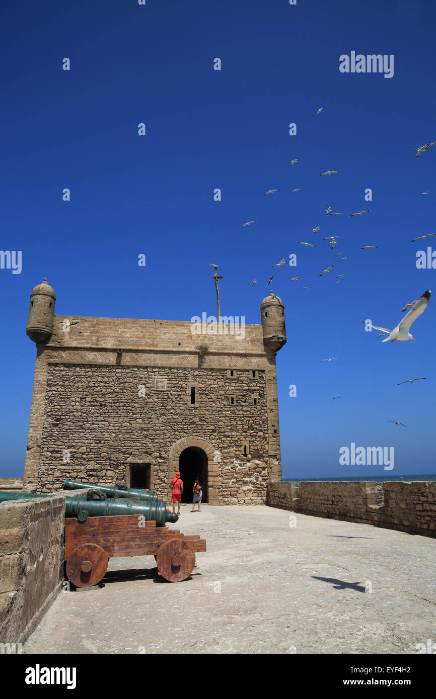 Tourists visiting the fortified tower in the Skala de la Ville in ...