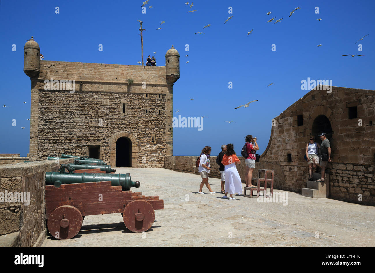 Tourists visiting the fortified tower in the Skala de la Ville in ...
