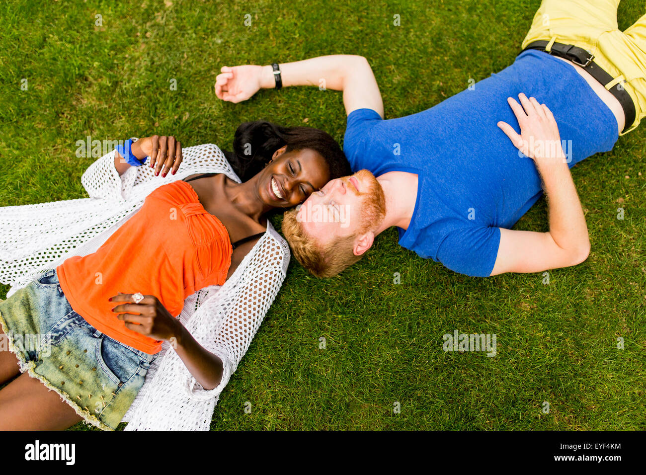 Multiracial couple in the park Stock Photo - Alamy