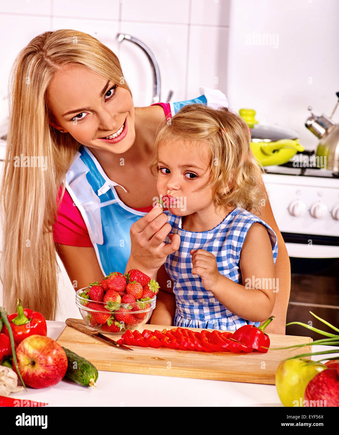 Mother and child cooking at kitchen Stock Photo - Alamy