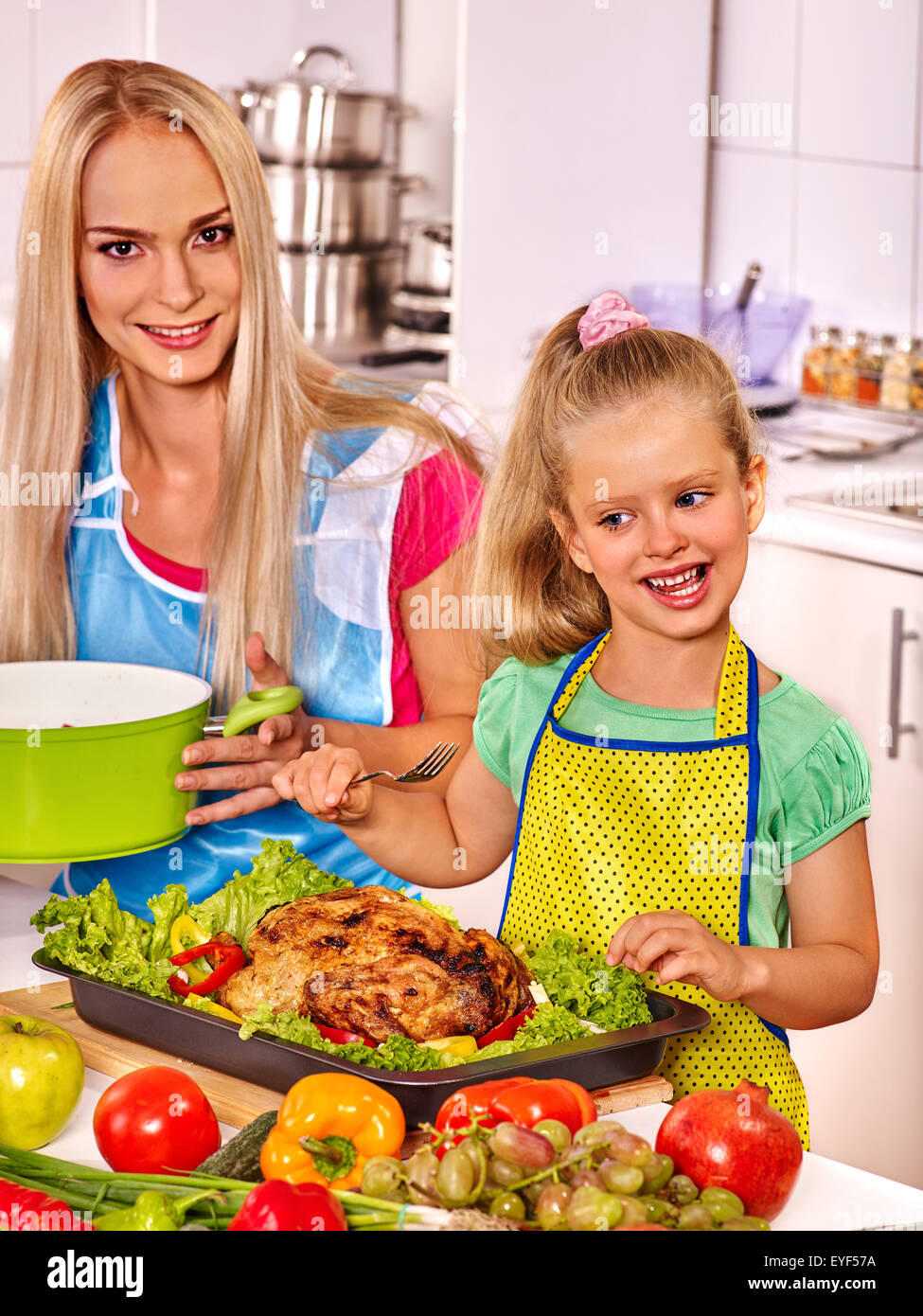 Woman cooking chicken at kitchen Stock Photo - Alamy