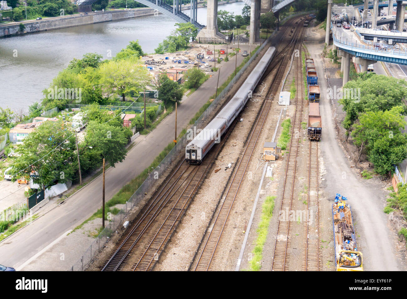 A Metro-North commuter train travels next to the Harlem River in the ...