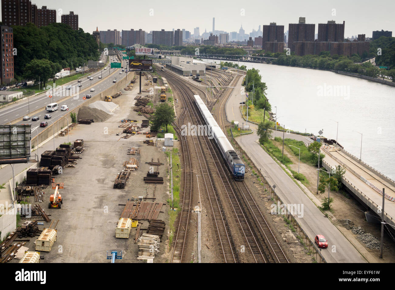 A Metro-North commuter train travels next to the Harlem River in the ...