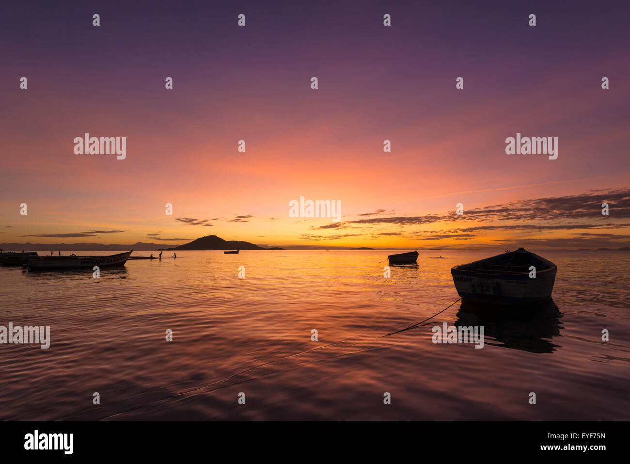 Fishing boats at dusk, Cape Maclear, Lake Malawi; Malawi Stock Photo ...