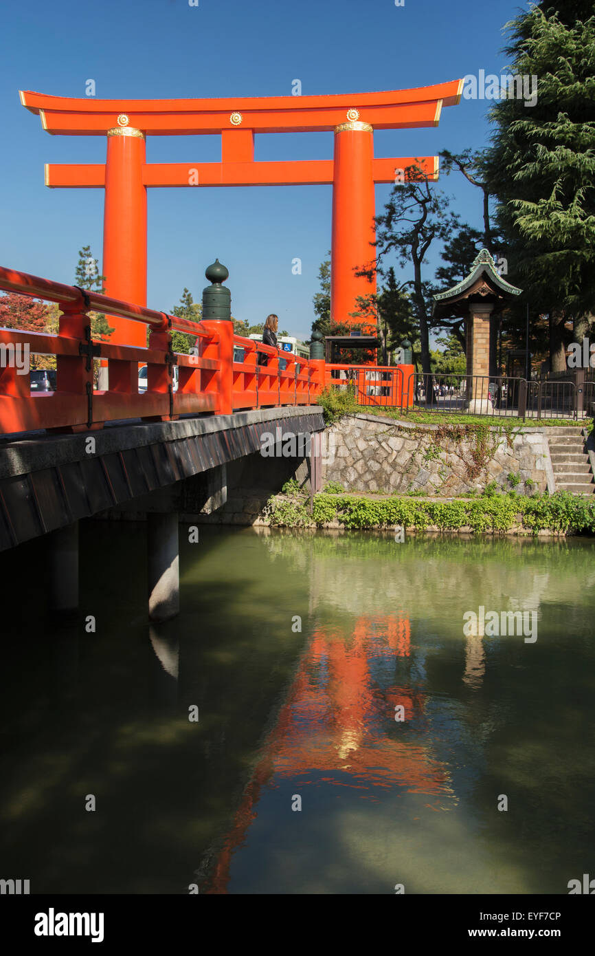 Large tori gate seen from a river bank and bridge; Kyoto, Japan Stock ...