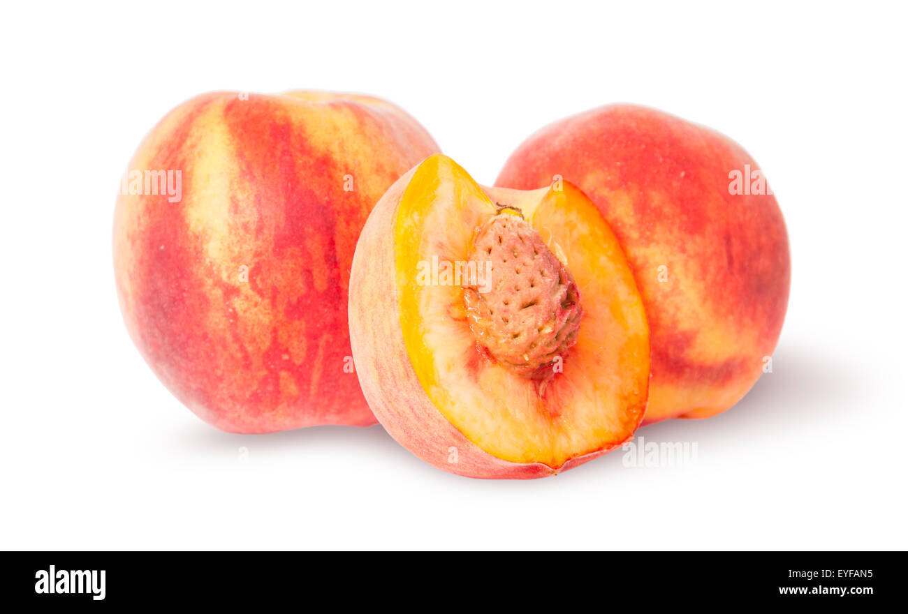 Two whole and half of peach isolated on white background Stock Photo ...