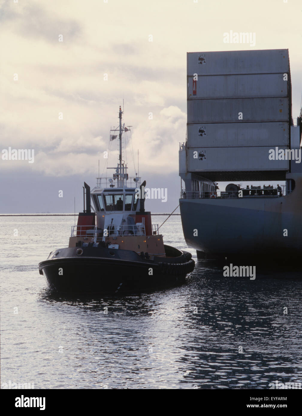 containership with tug assist Stock Photo - Alamy