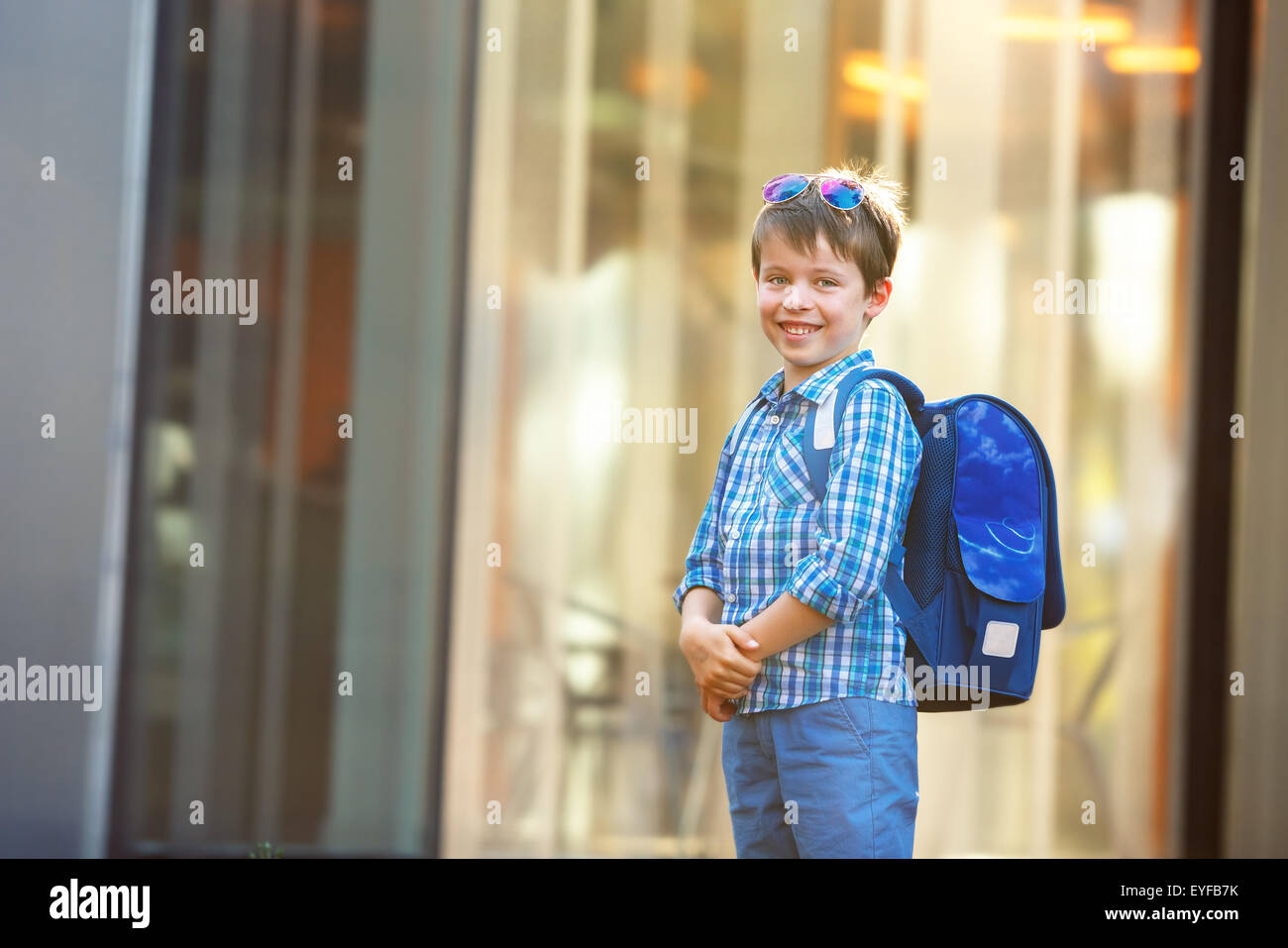 Portrait of cute school boy with backpack Stock Photo - Alamy