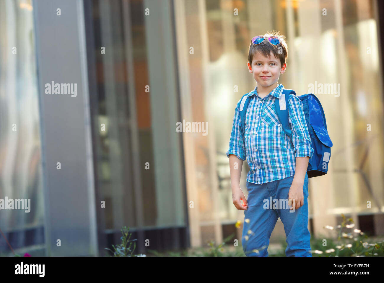 Portrait of cute school boy with backpack Stock Photo - Alamy