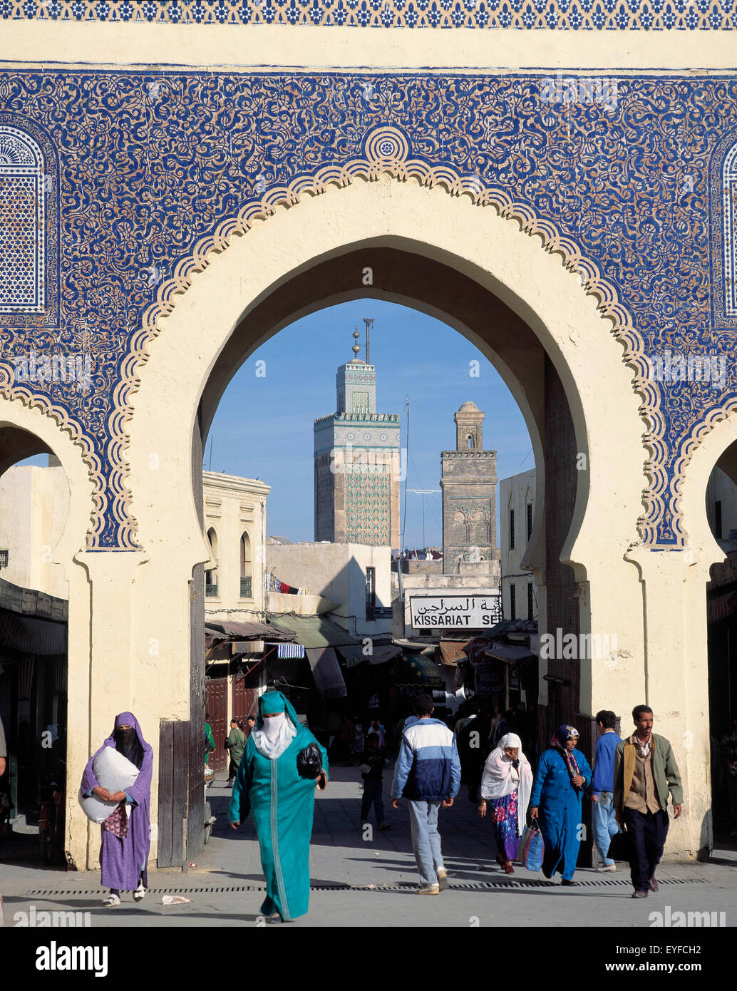 People Walking By City Gate Stock Photo - Alamy