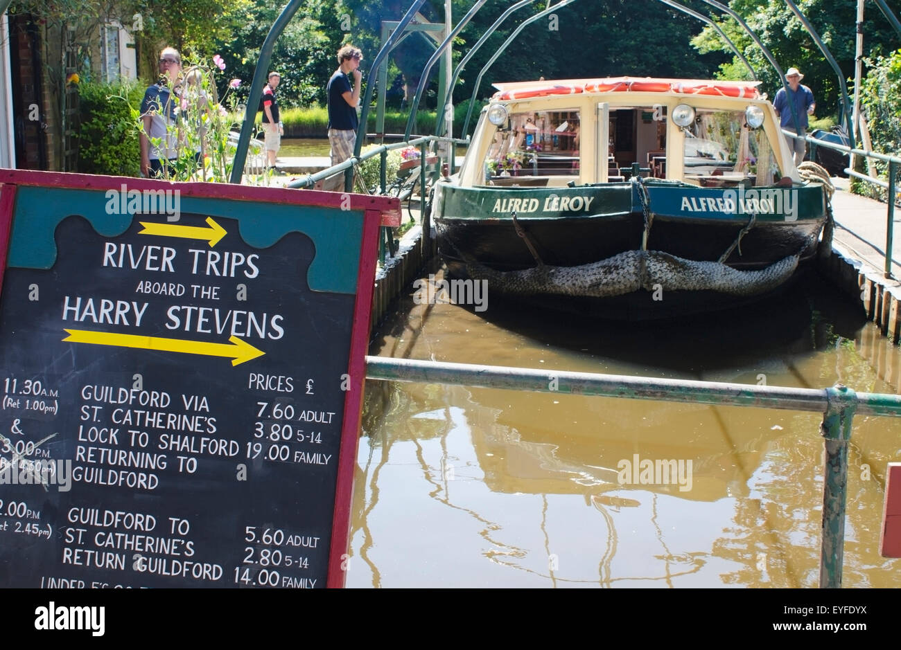 United Kingdom, England, Surrey, Tourist boat docked at Guildford canal ...