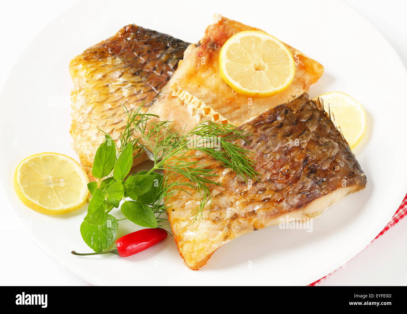 Oven baked carp fillets with crispy skin Stock Photo - Alamy